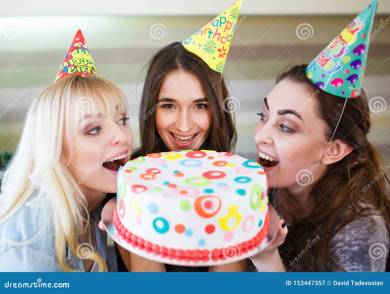 Birthday. Girls Bite Cake at a Birthday Party Stock Image - Image of ...
