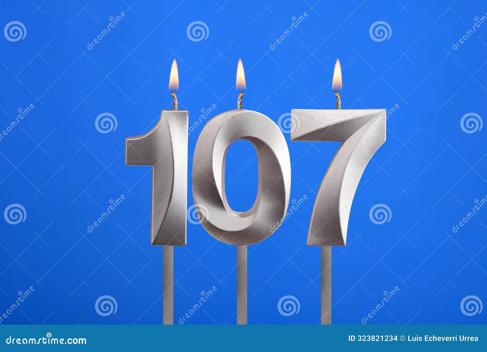 Birthday Number 107 - Candle Lit on Blue Background Stock Photo - Image ...