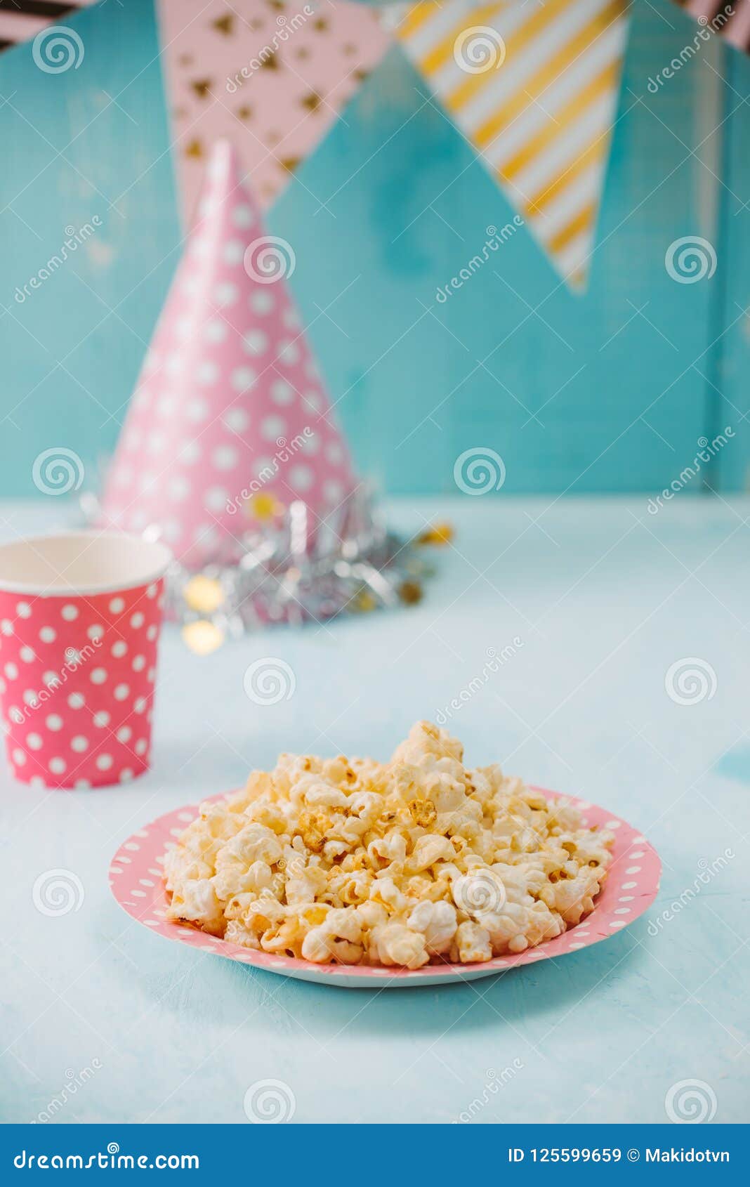 Birthday Party Items with Popcorn on Table Stock Image - Image of ...