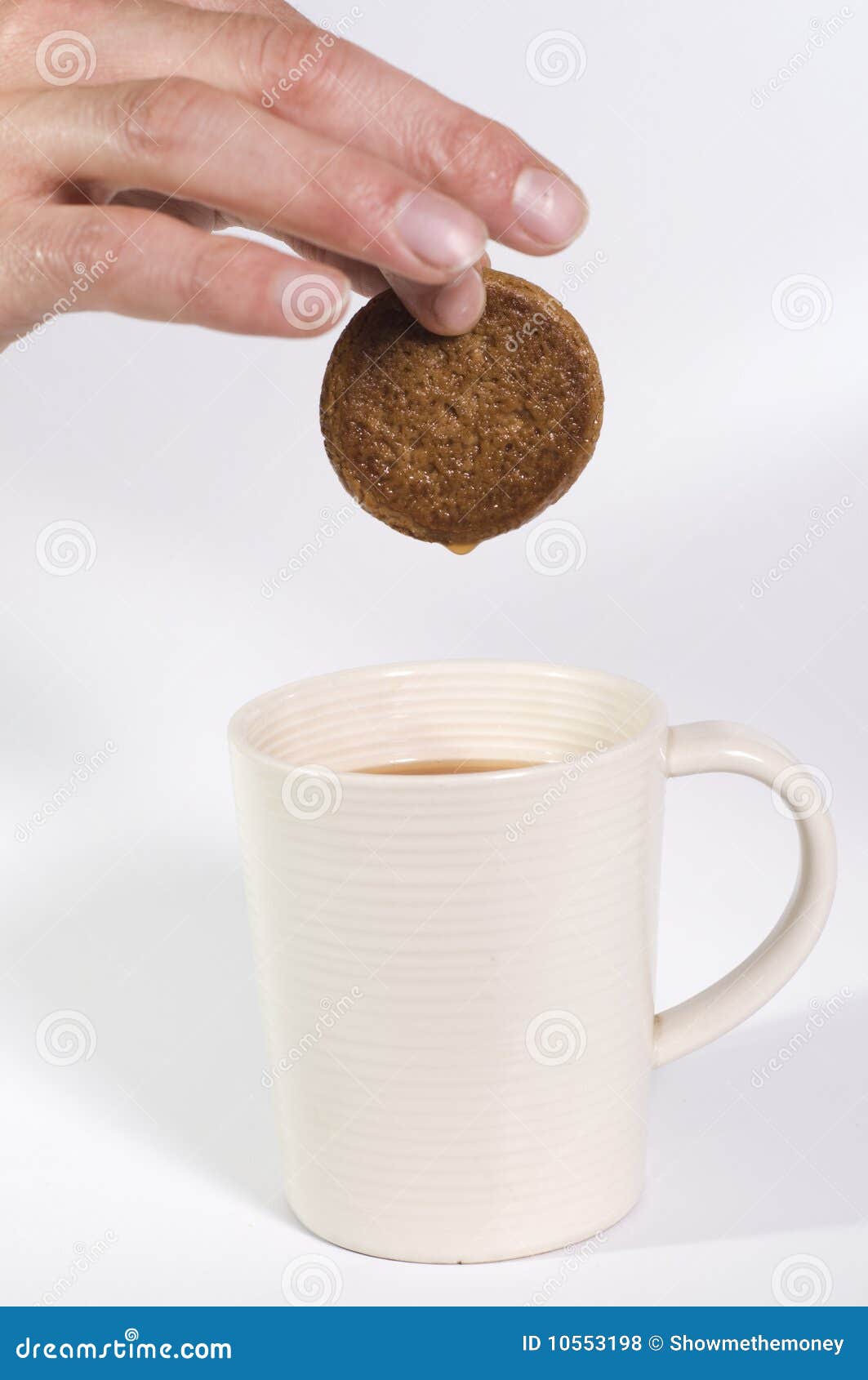 Biscuit Being Dipped in Tea Stock Photo - Image of white, isolated ...