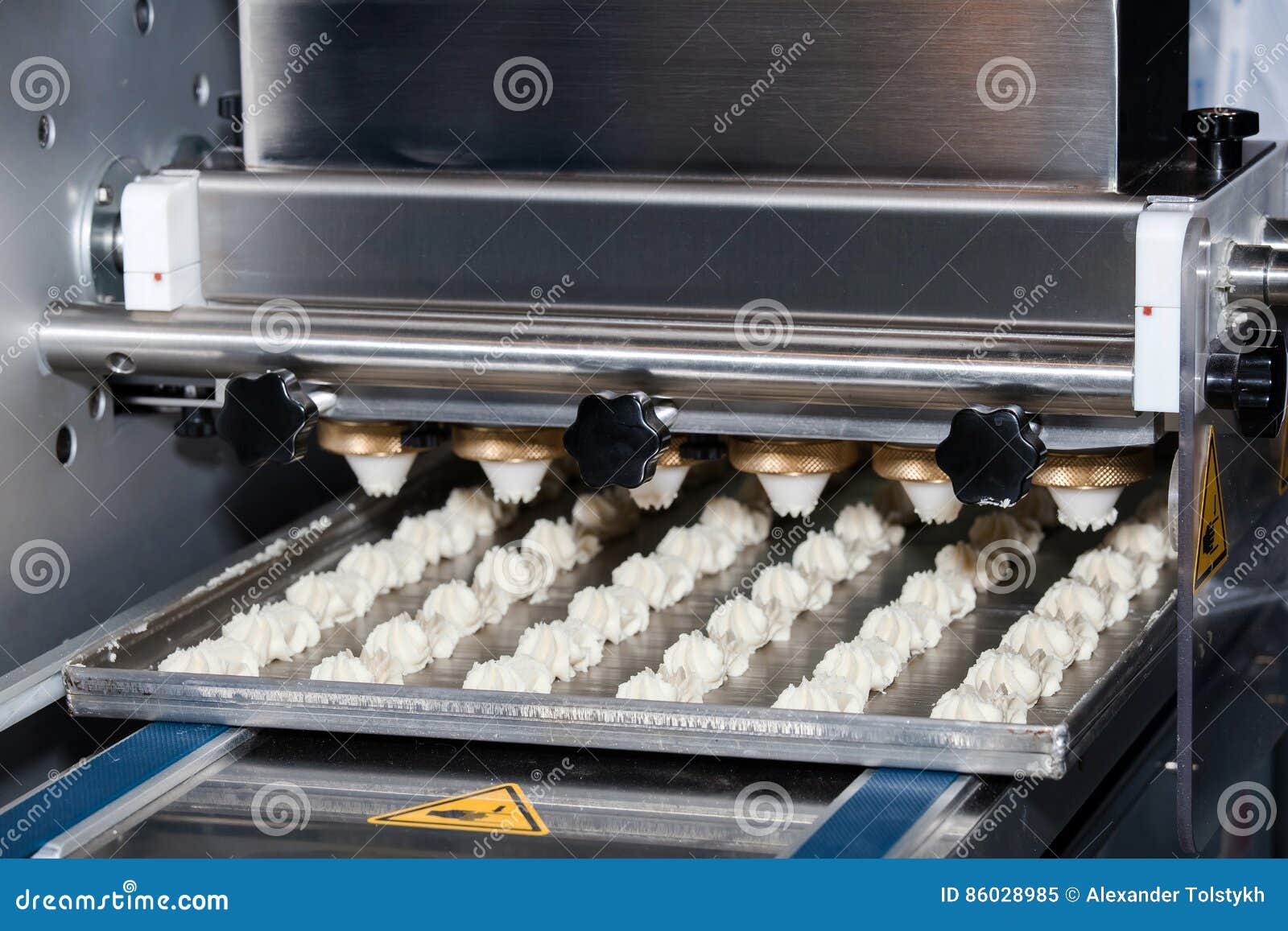 Biscuit depositing machine stock image. Image of dropping - 86028985