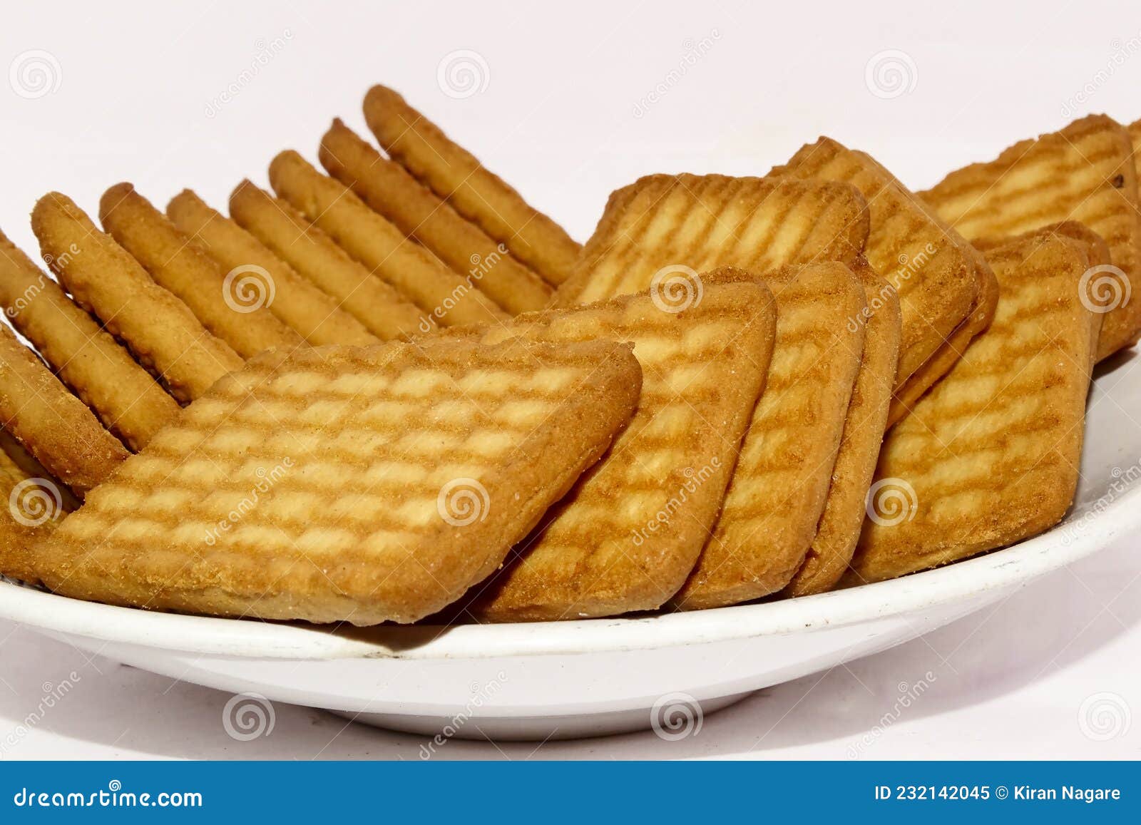 Biscuit on plate stock image. Image of golden, glass - 232142045