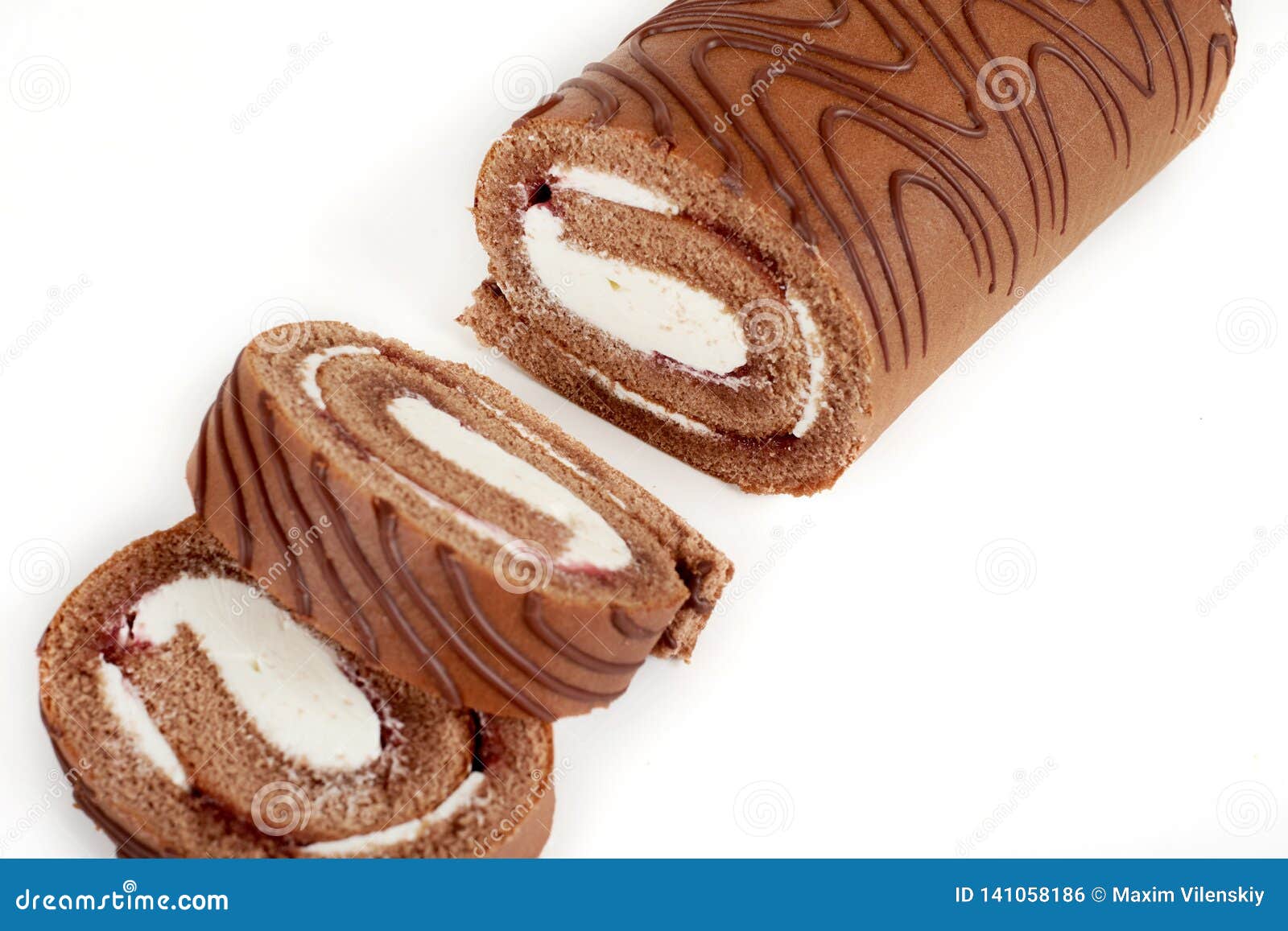 Biscuit Roll Cut into Pieces, on a White Background. Stock Photo ...