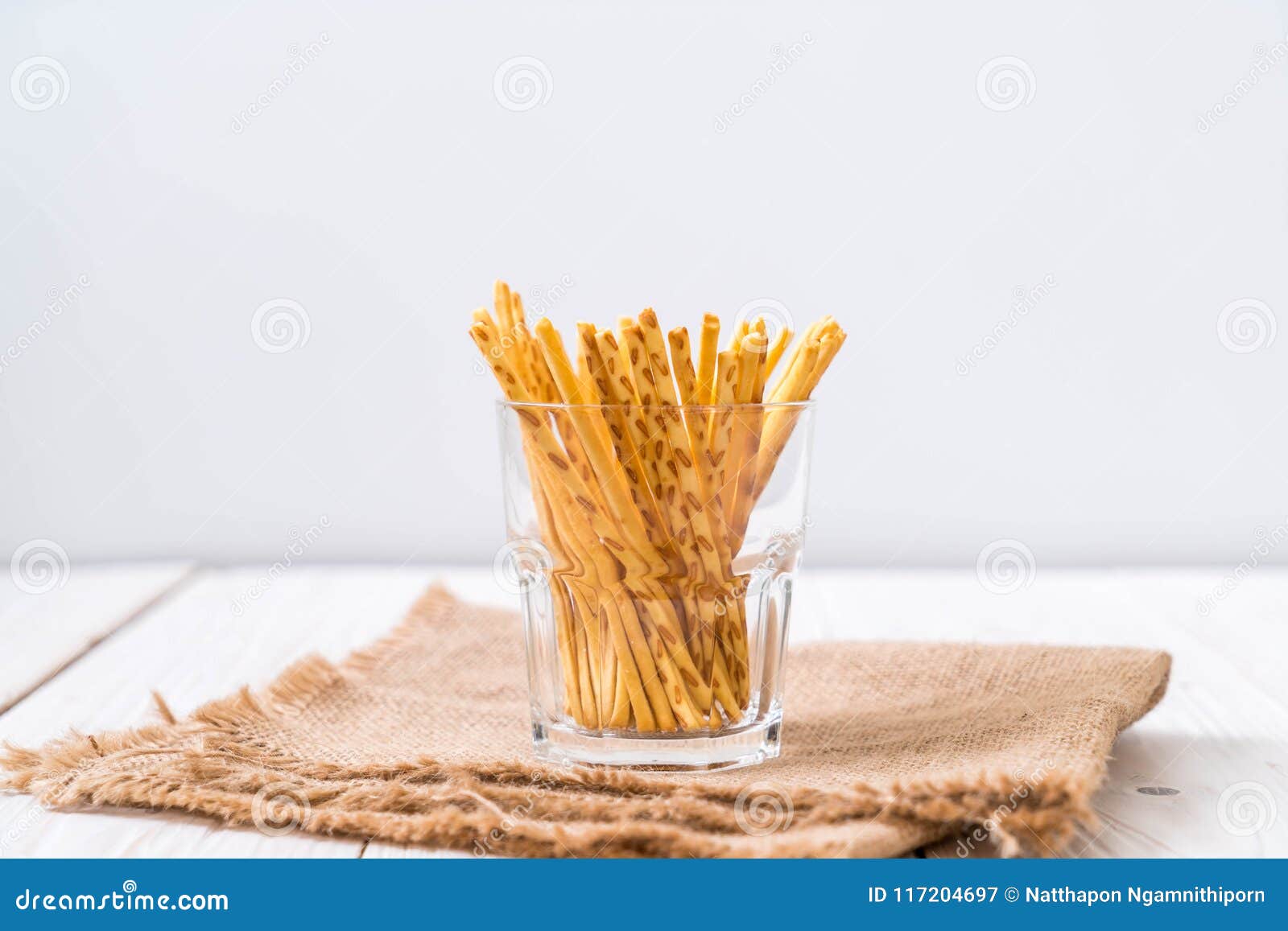 Biscuit sticks on wood stock image. Image of straw, long - 117204697