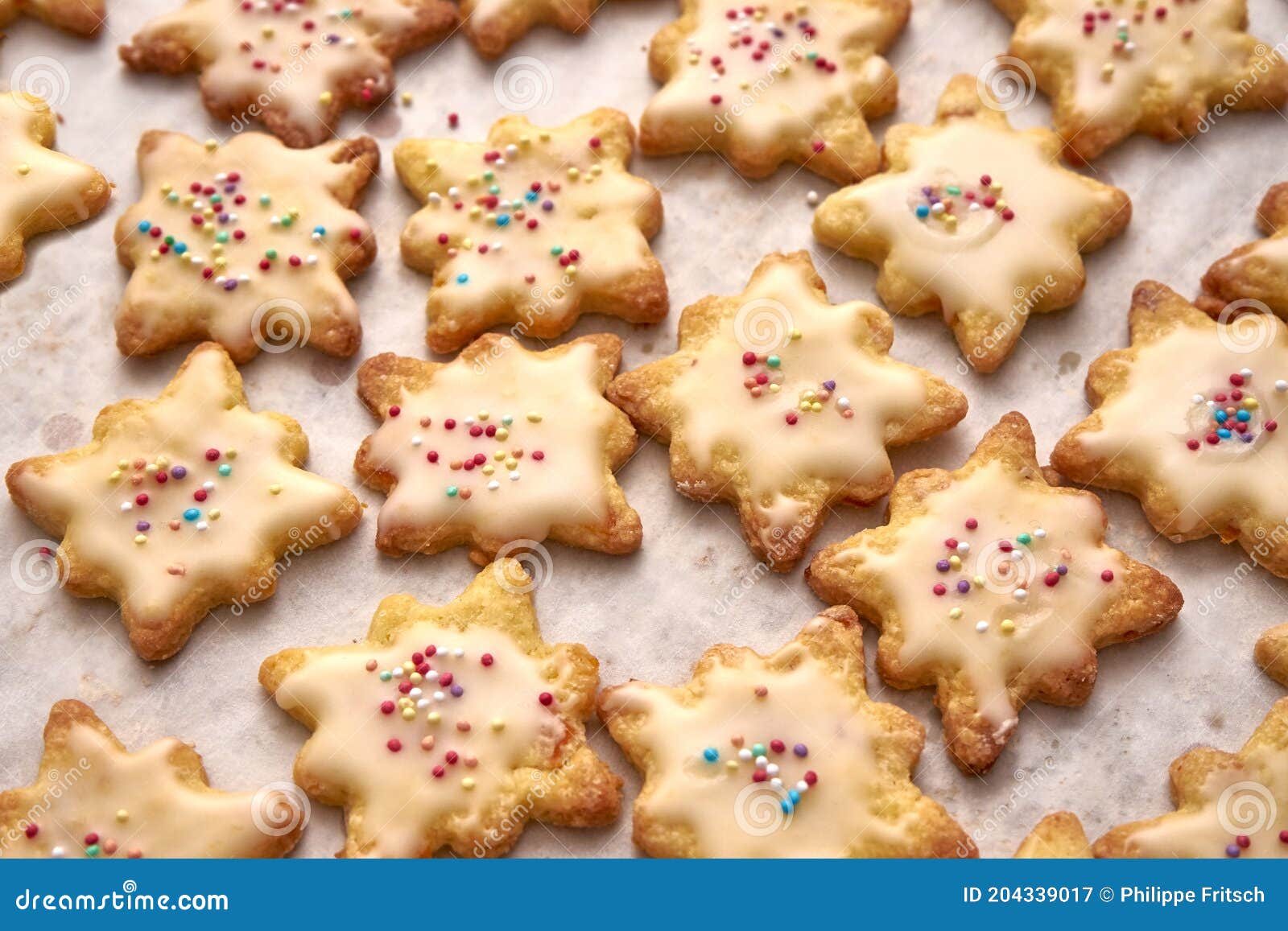 Biscuits Coated with Sugar Icing with Decorative Color Balls on a Sheet ...