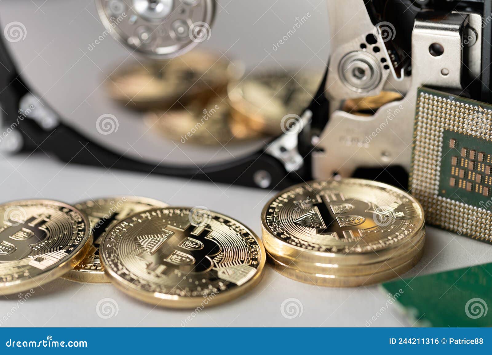 Bitcoin Coins Next To Hard Drive and Microprocessor. Coins Reflecting ...