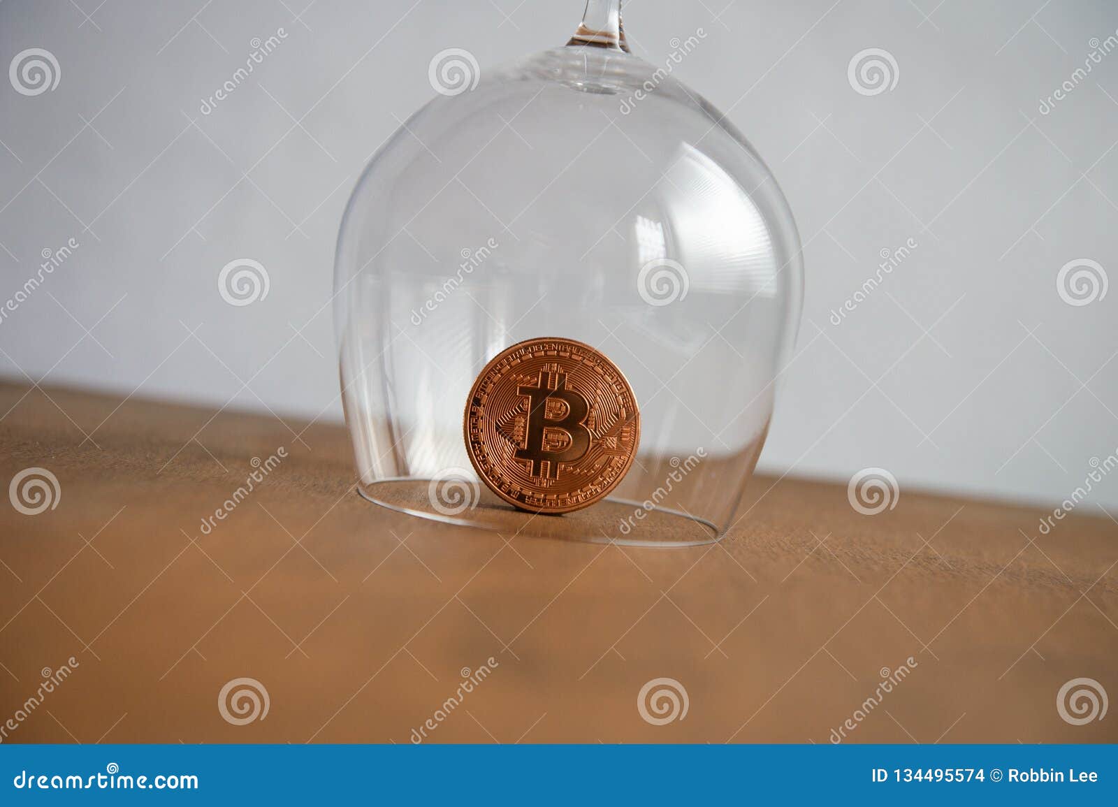 Bitcoin covered by a glass stock photo. Image of figure - 134495574