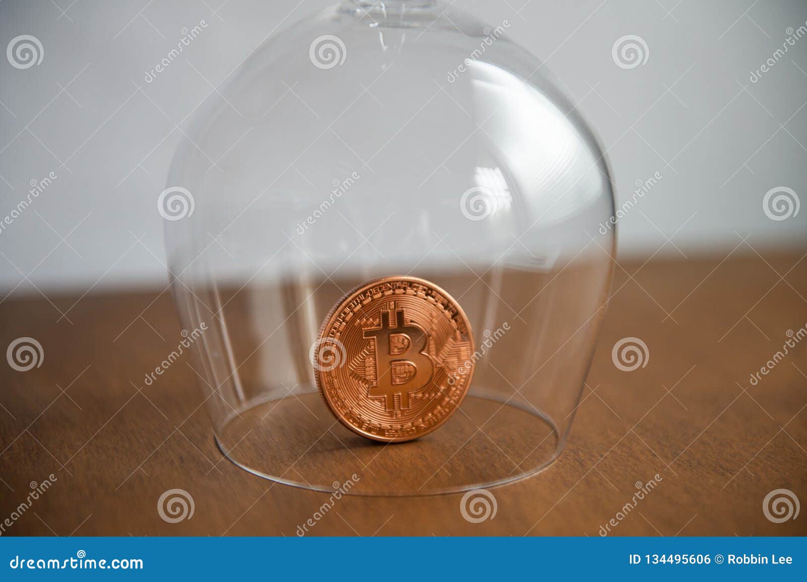 Bitcoin covered by a glass stock photo. Image of detail - 134495606
