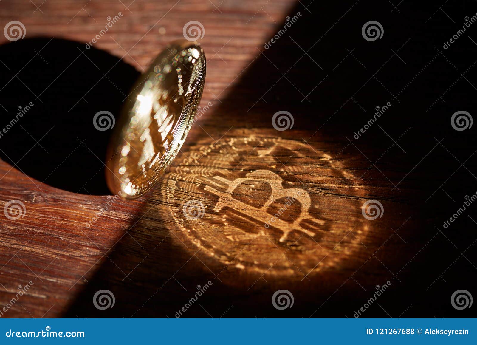 Bitcoin Cryptocurrency with Its Shadow on Wooden Table, Close-up ...