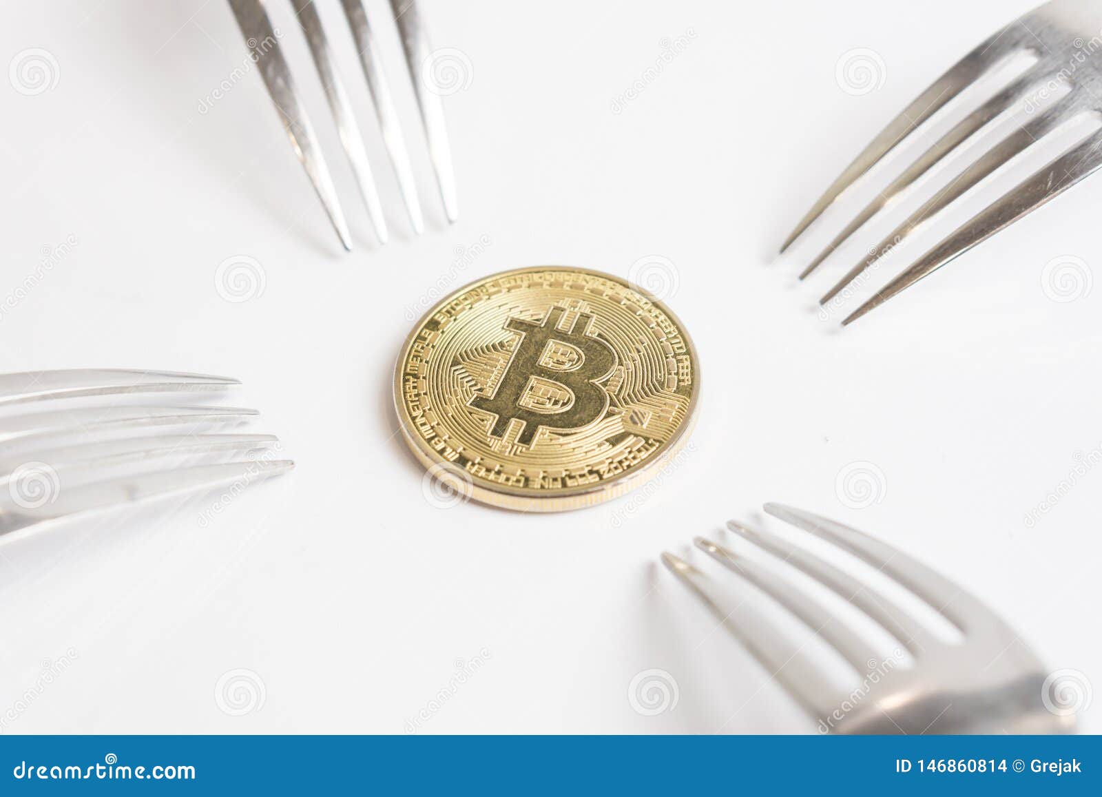 Bitcoin Cryptocurreny Coin Placed between Forks with Reflection, Hard ...