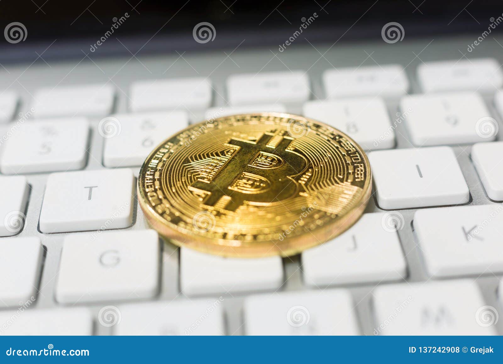 Bitcoin Gold Coin on a Computer Keyboard Stock Photo - Image of bank ...