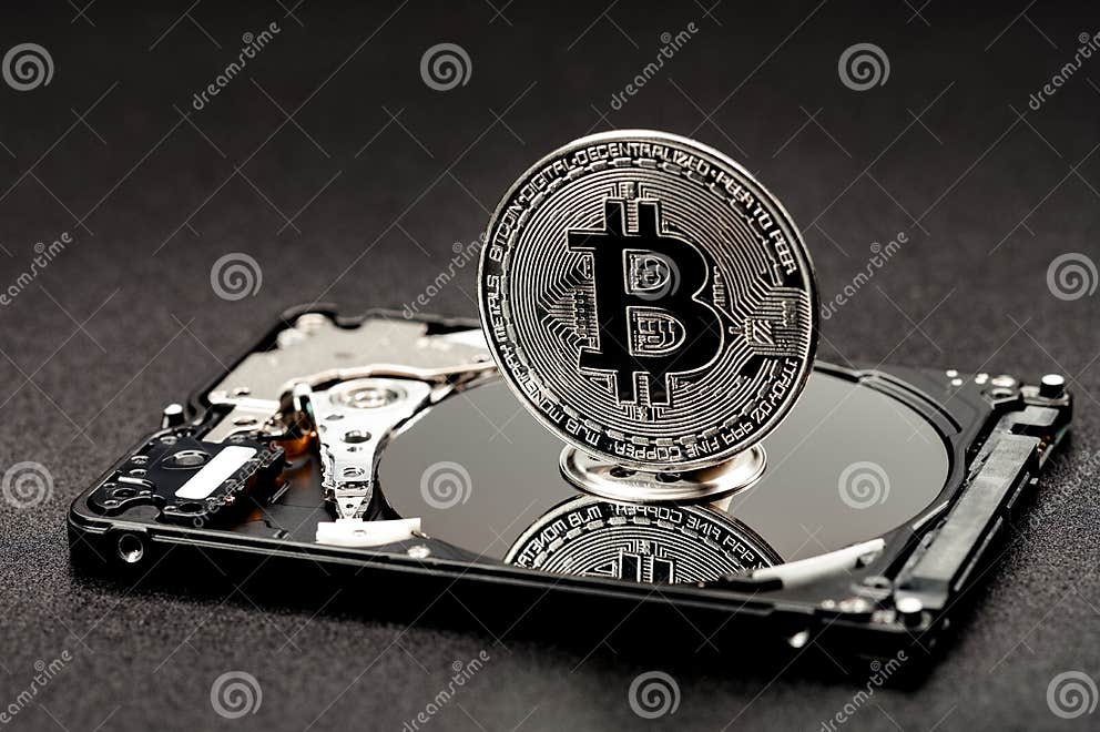 Bitcoin on a Hard Disk on a Black Background, the Concept of Mining ...