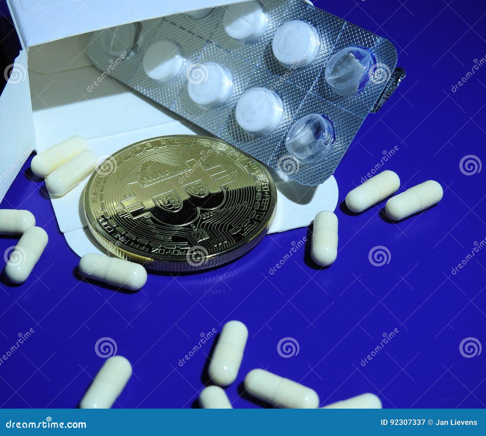 Bitcoin and pills stock image. Image of bitcoin, drop - 92307337