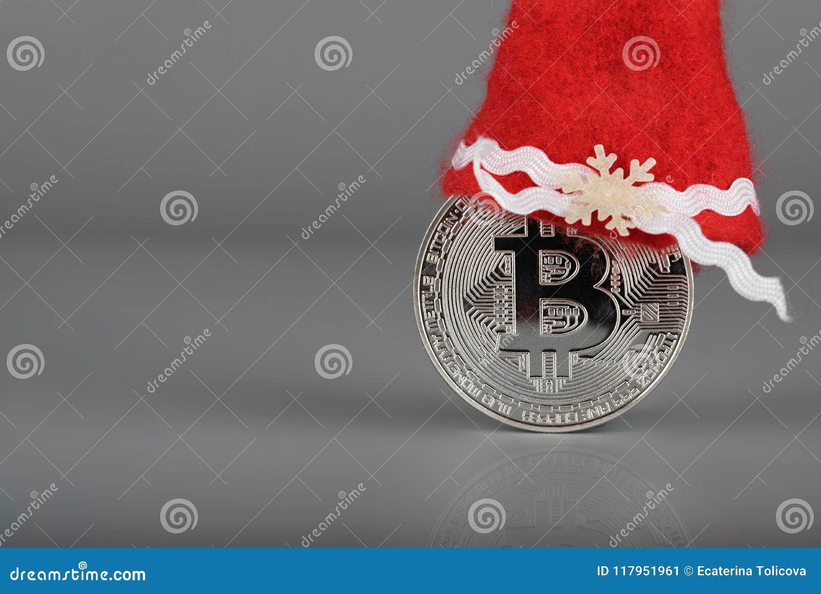 Bitcoin in a Santa Claus Hat on a Gray Surface. Stock Image - Image of ...