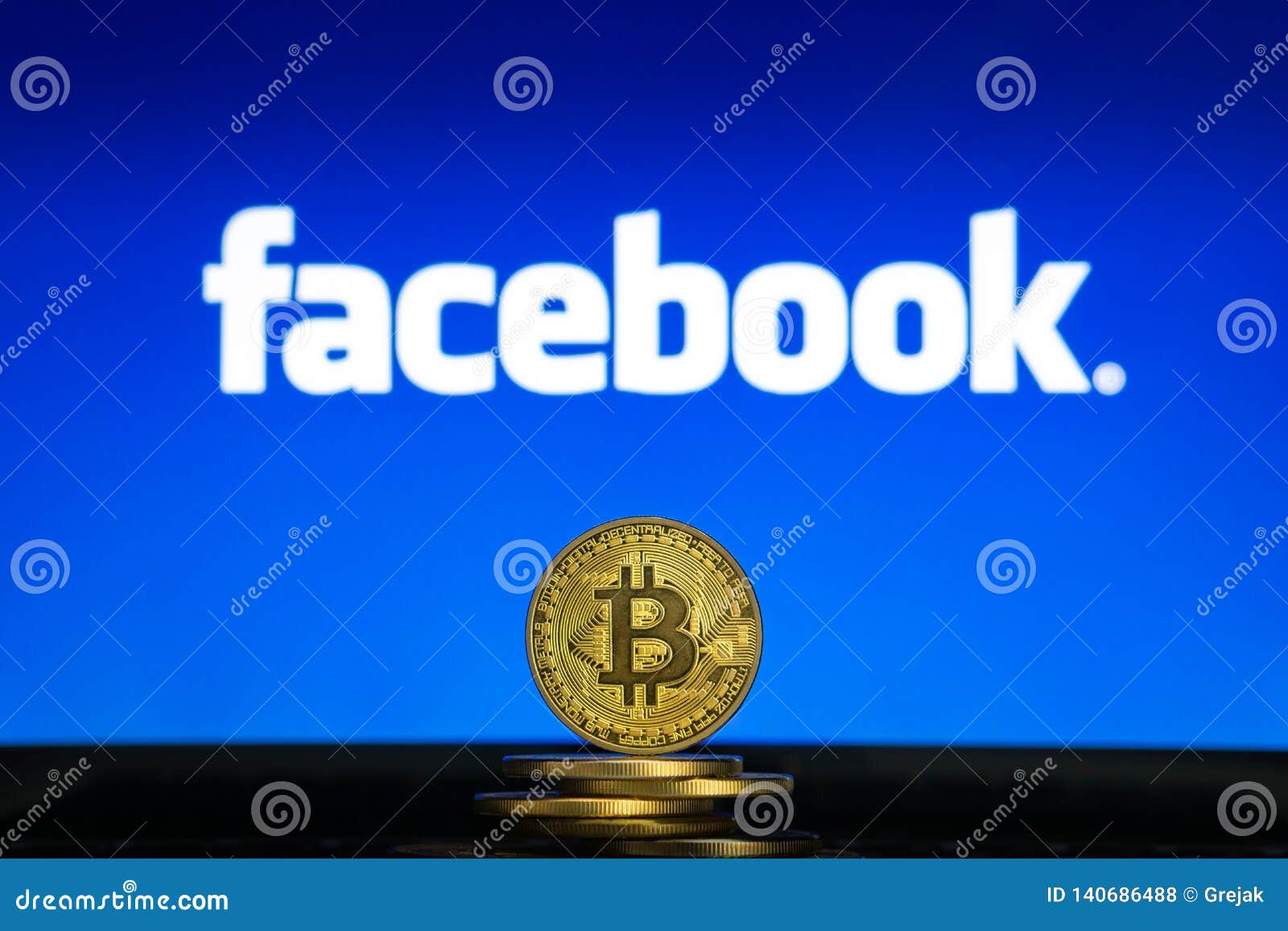 Facebook Logo on a Computer Screen with a Stack of Bitcoin ...