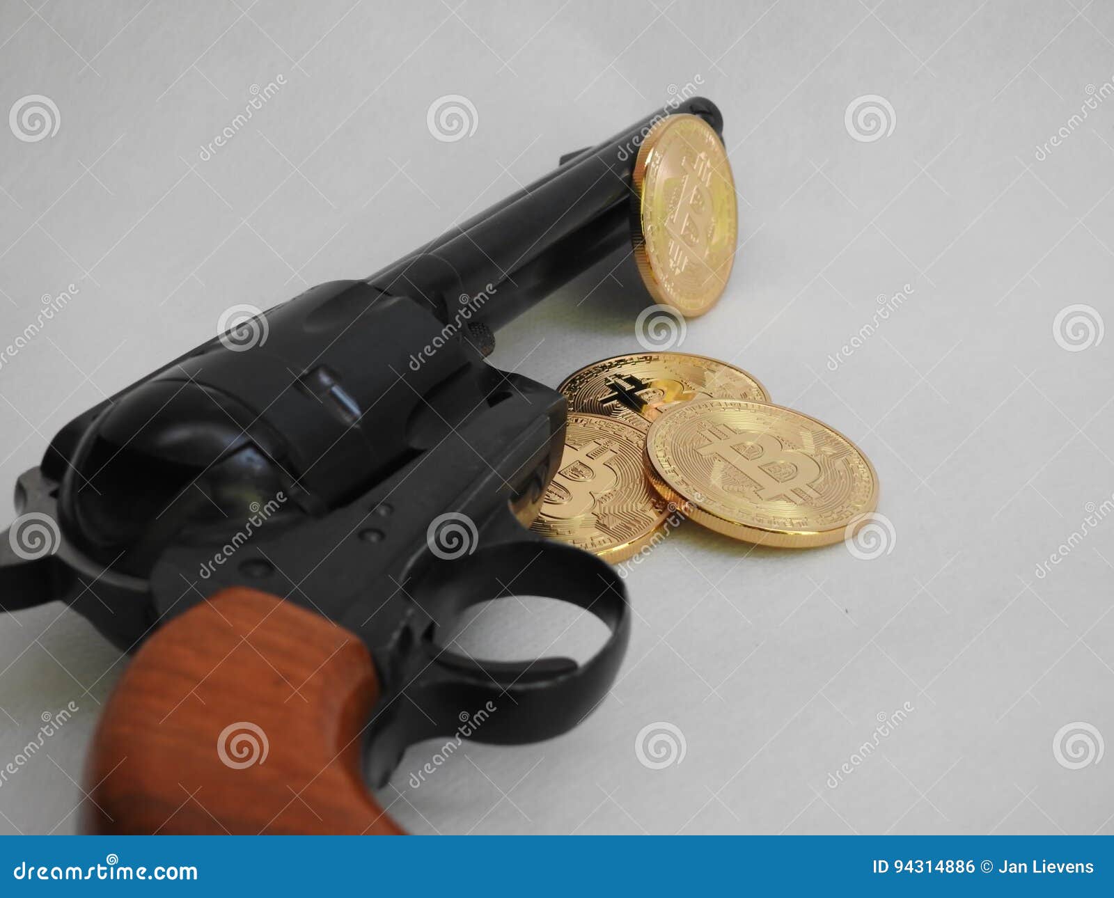 Bitcoins and revolver stock photo. Image of ammunition - 94314886