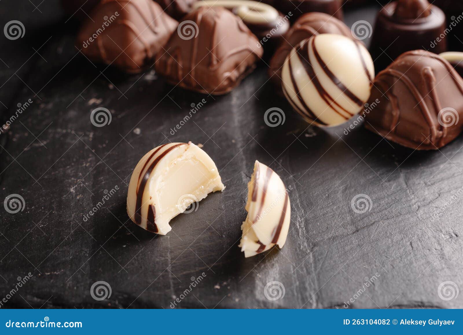 A Bite of Candy. Chocolate Candies with Different Fillings Stock Photo ...