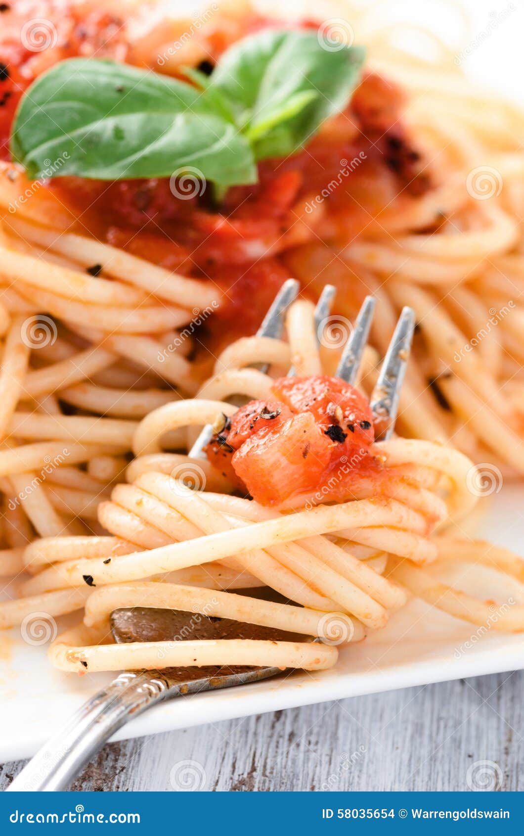 Bite of Pasta with Red Sauce on a Fork Stock Photo - Image of herb ...