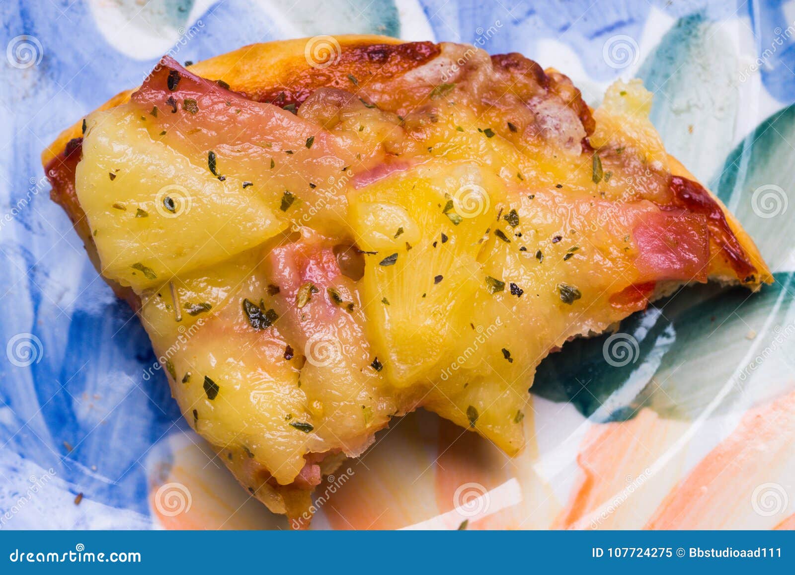 Bite-sized piece of pizza stock image. Image of slice - 107724275