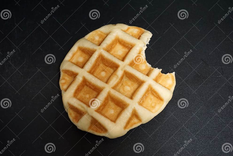 Bite of waffle stock image. Image of thin, food, sweet - 75777545