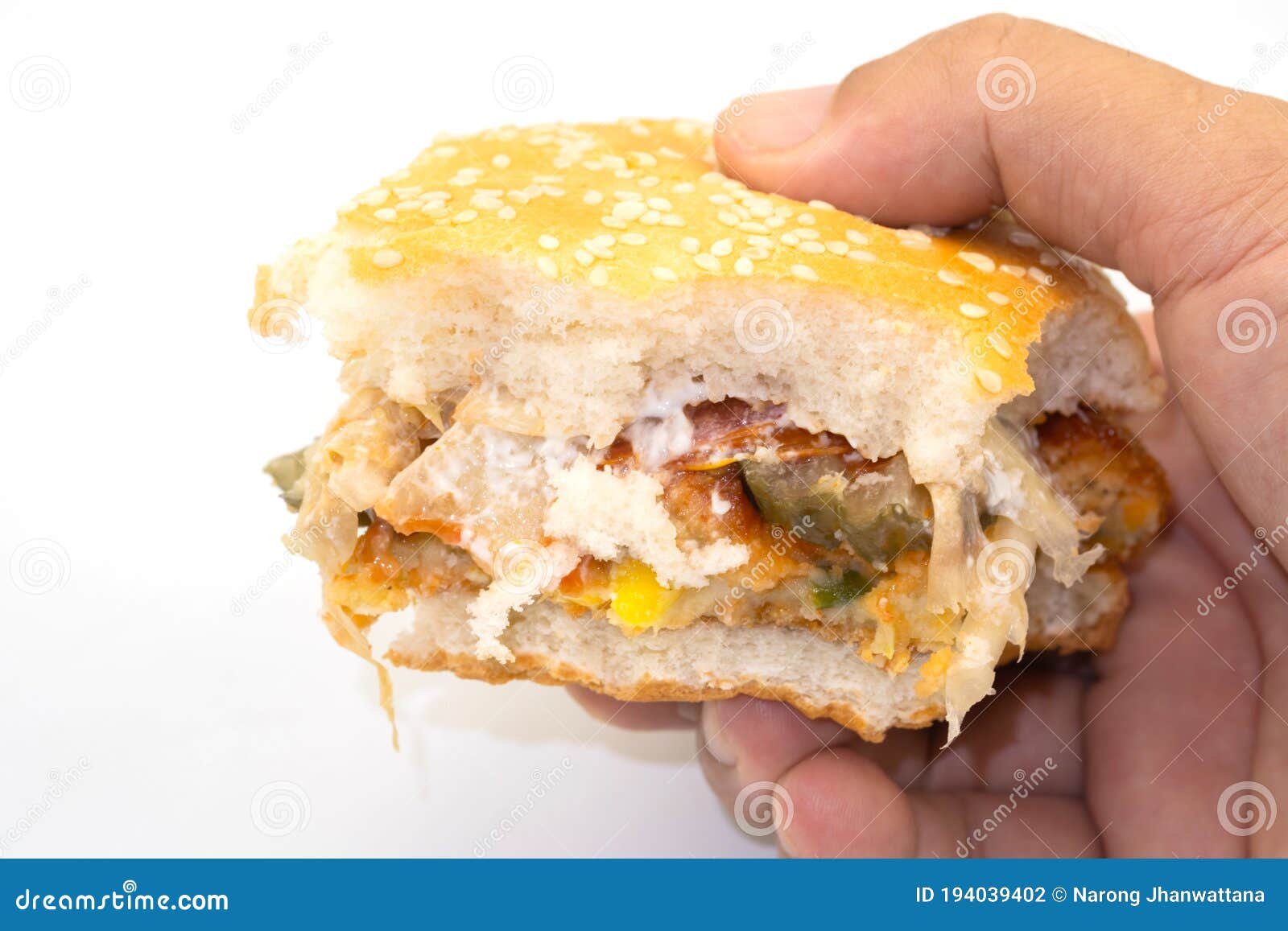 Bitten burger stock photo. Image of bite, holding, ketchup - 194039402