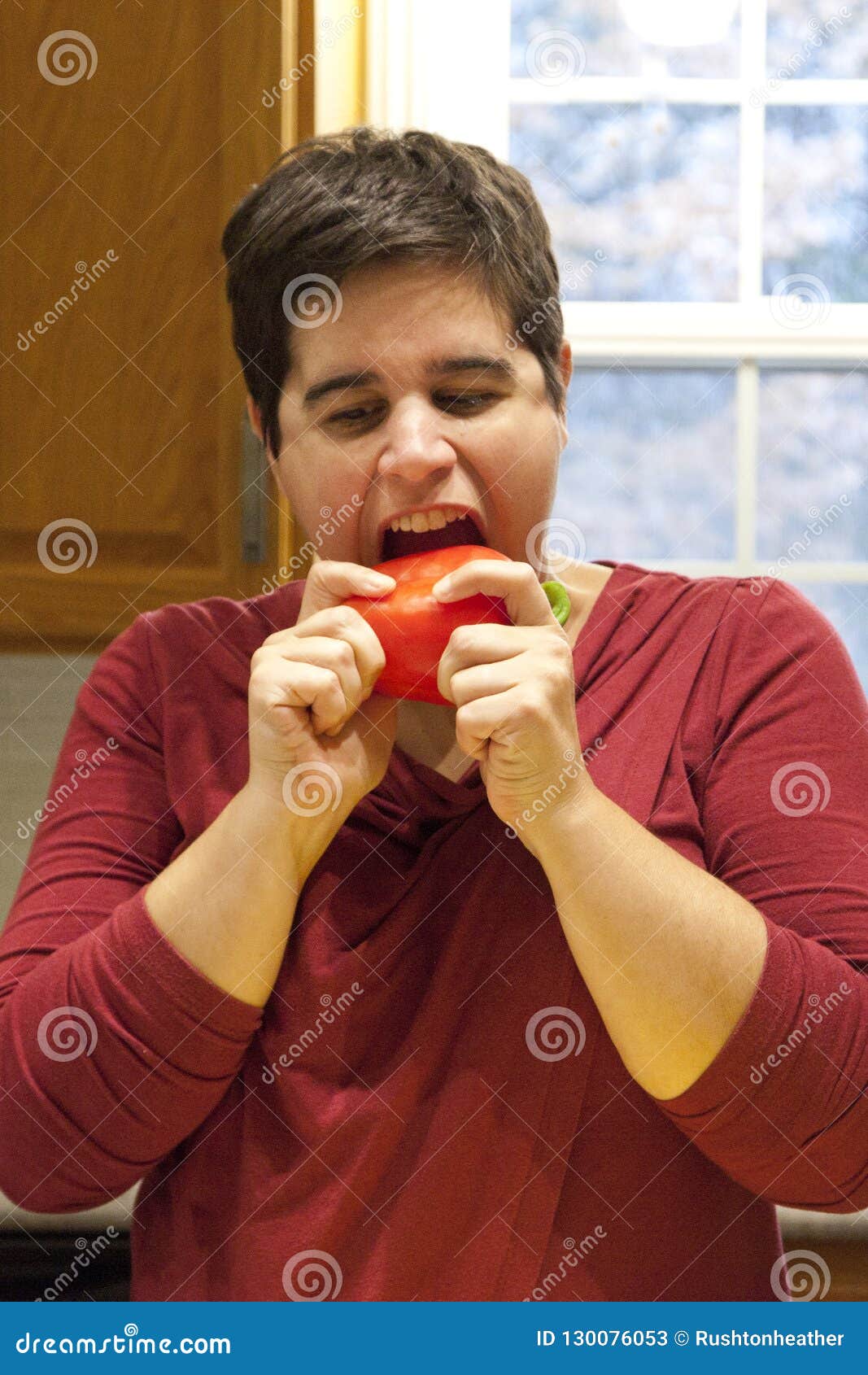 Biting into red pepper stock image. Image of meal, person - 130076053