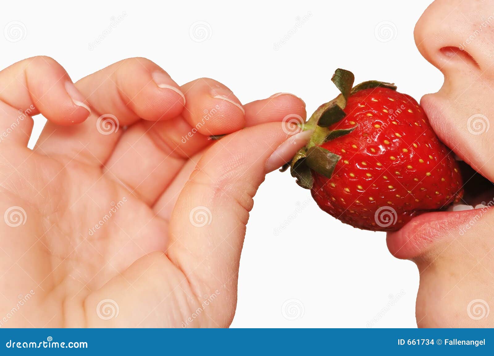 Biting a strawberry stock photo. Image of tasting, fingers - 661734