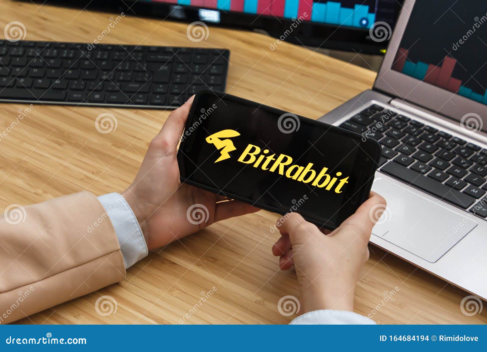 Bitrabbit Cryptocurrency Exchange Market. Female Trader Hands Holding the Smartphone Using ...