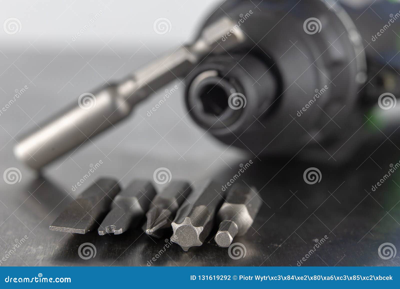 Bits for a Screwdriver on a Metal Workshop Table. Workshop Accessories ...