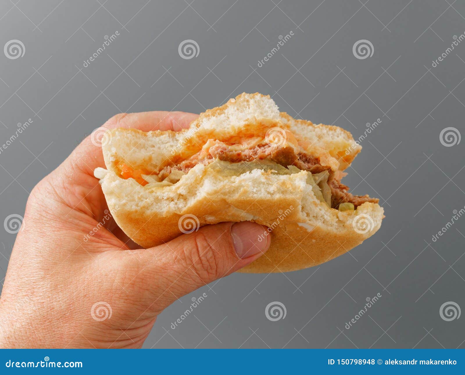 Bitten Big Burger with Cutlet Cheese and Tomato on a Gray Background ...