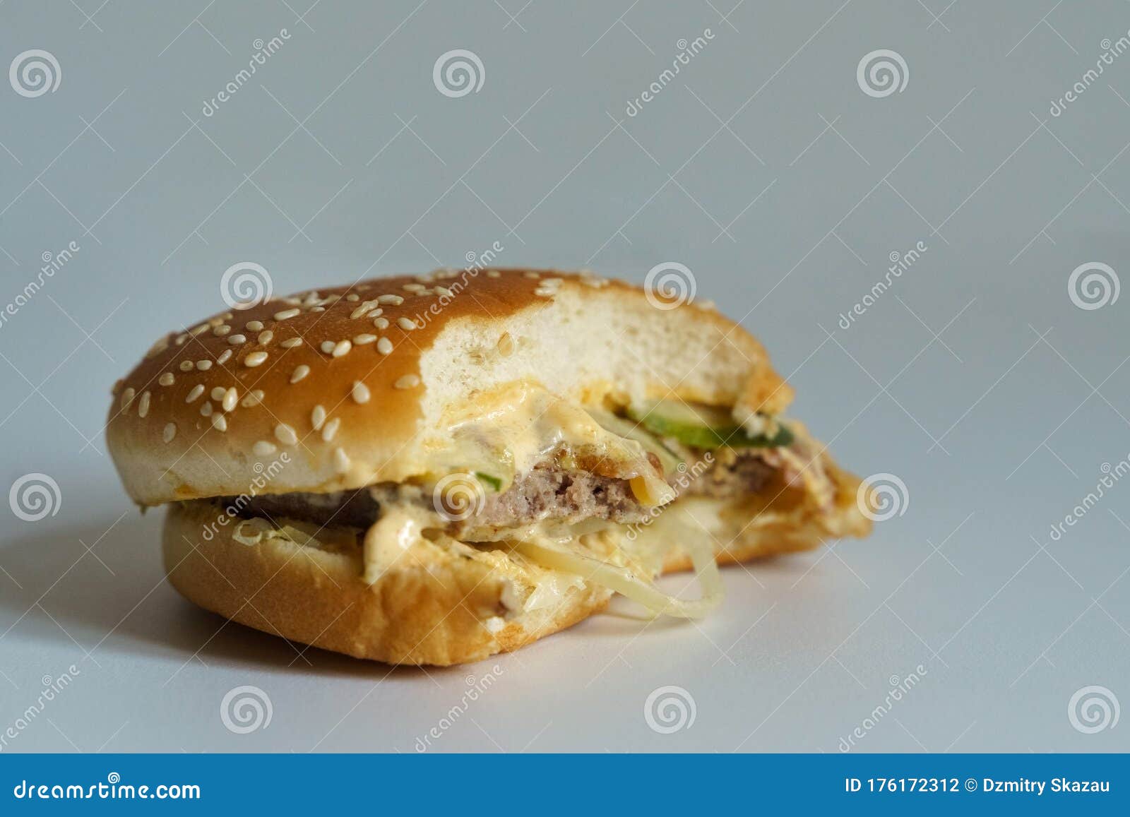Bitten Burger on a White Background Stock Photo - Image of onion, meal ...