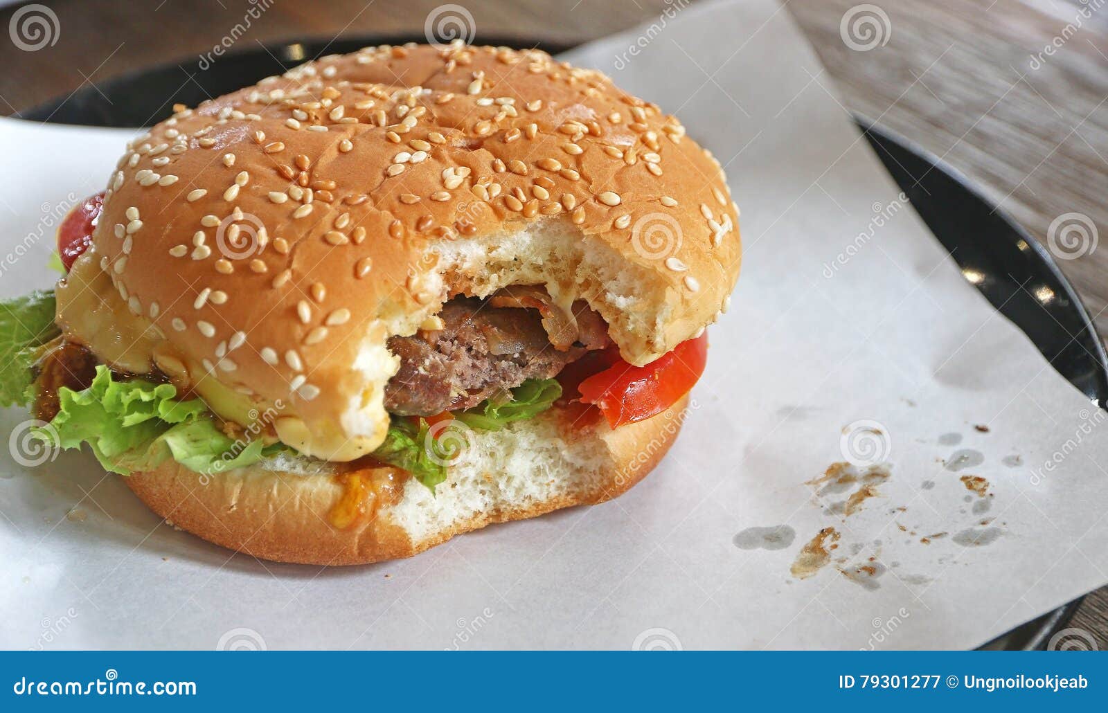 Bitten hamburger stock image. Image of fries, bite, meal - 79301277