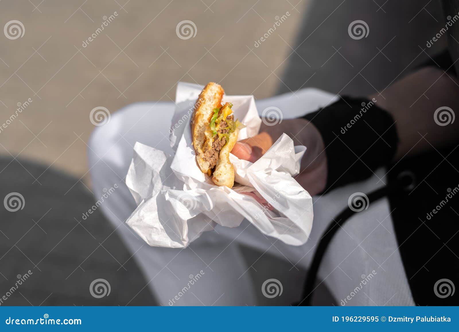 Bitten Hamburger in a Man Hand Close-up Stock Image - Image of bitten ...