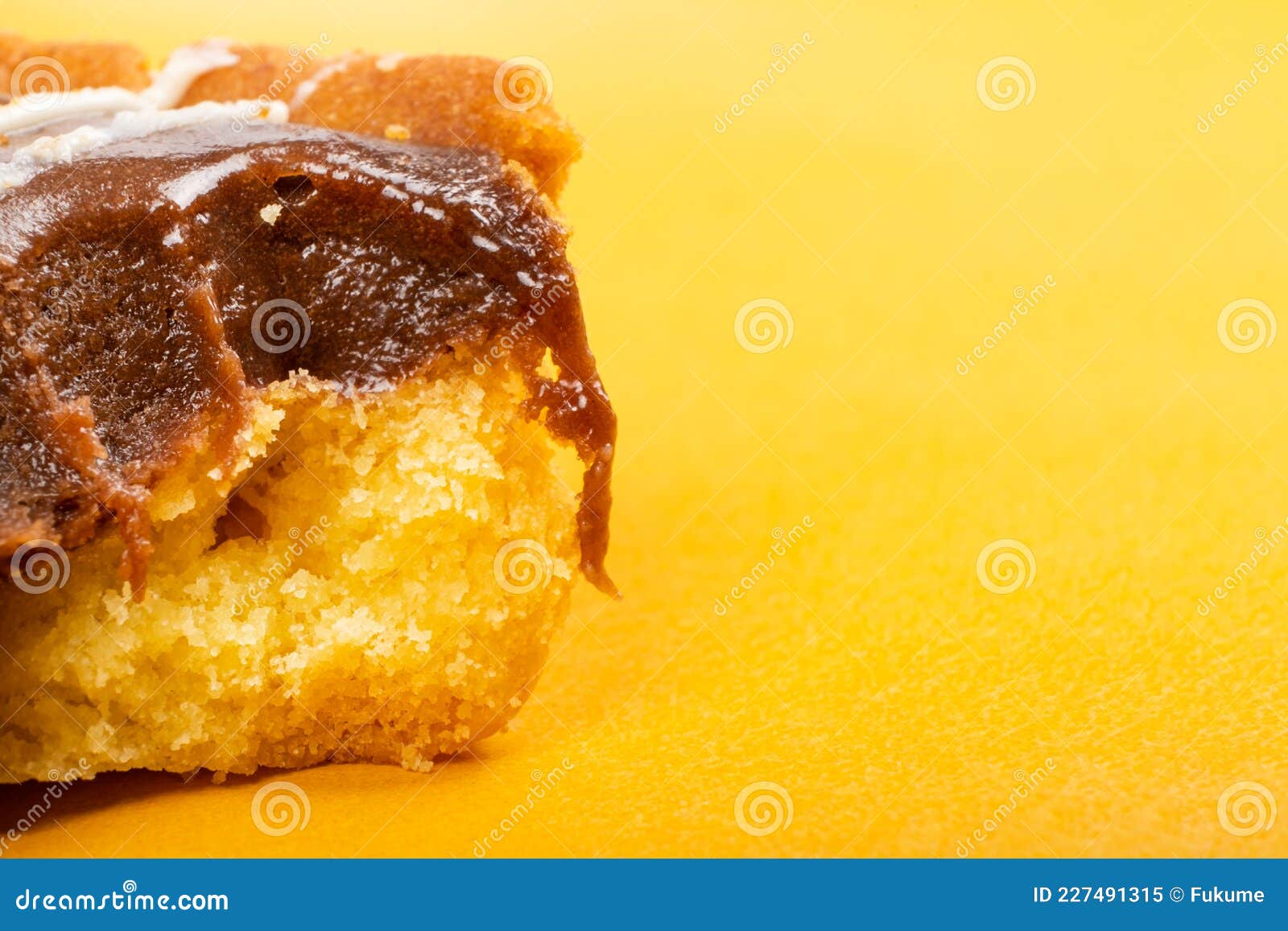 Bitten Off Cake on Yellow Background with Copy Space Stock Image ...