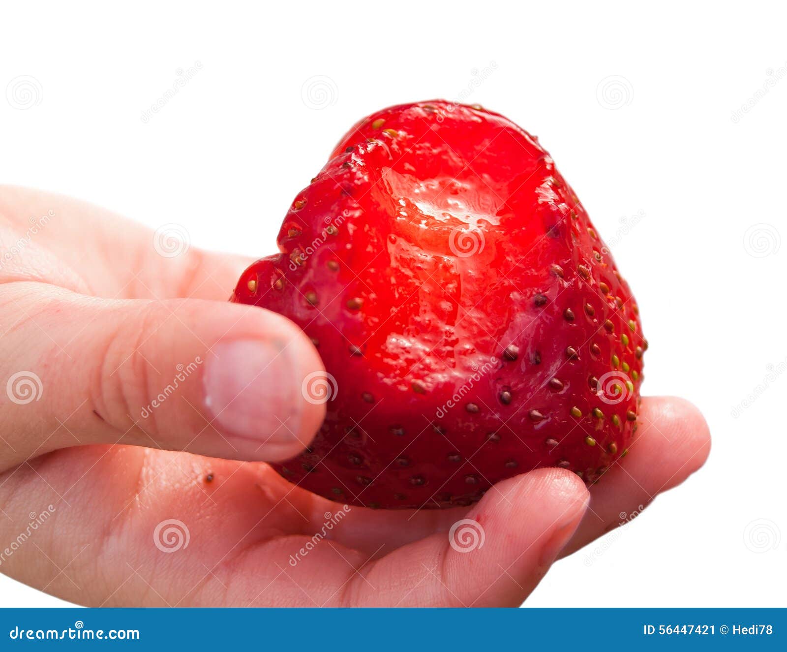 Bitten strawberry in hand stock image. Image of juicy - 56447421