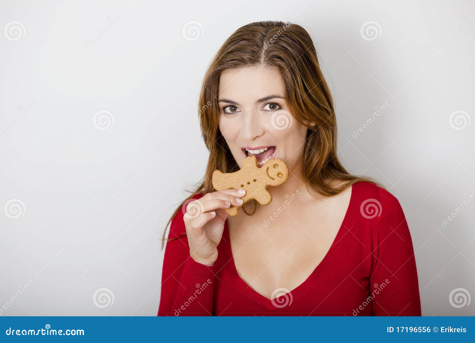Bitting a Gingerbread Cookie Stock Photo - Image of biscuit, expression ...