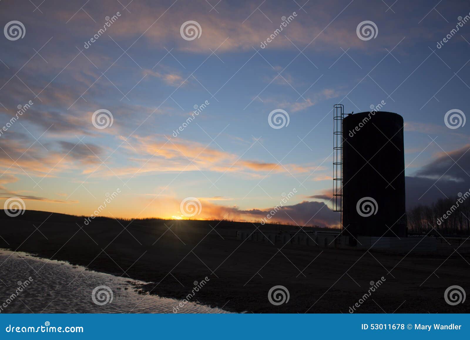 Silhouette Of Bitumen Tanks Under A Sunset Royalty-Free Stock Photo ...