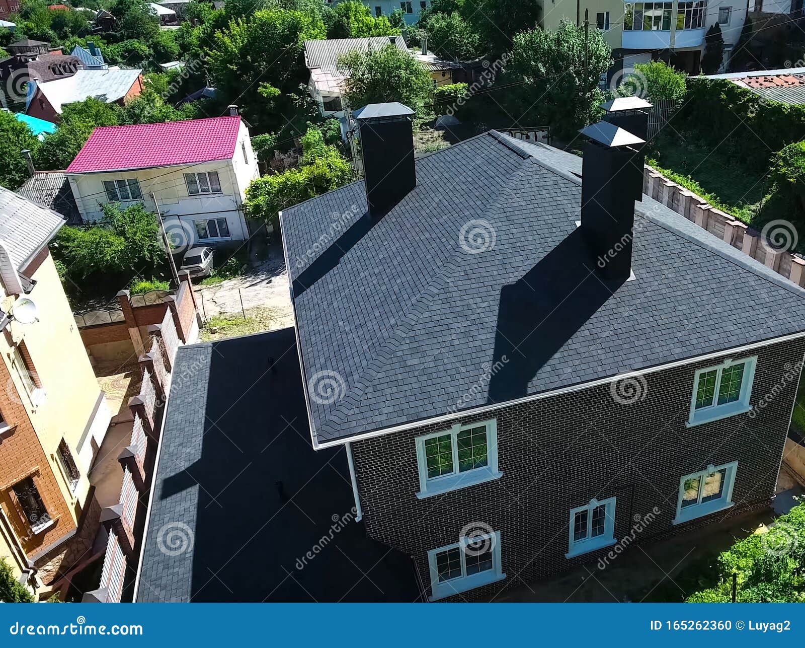 Bituminous Tile for a Roof. House with a Roof from a Bituminous Stock ...