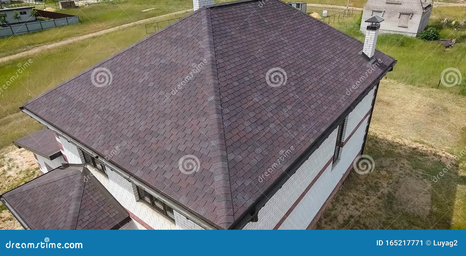 Bituminous Tile for a Roof. House with a Roof from a Bituminous Tile. a ...