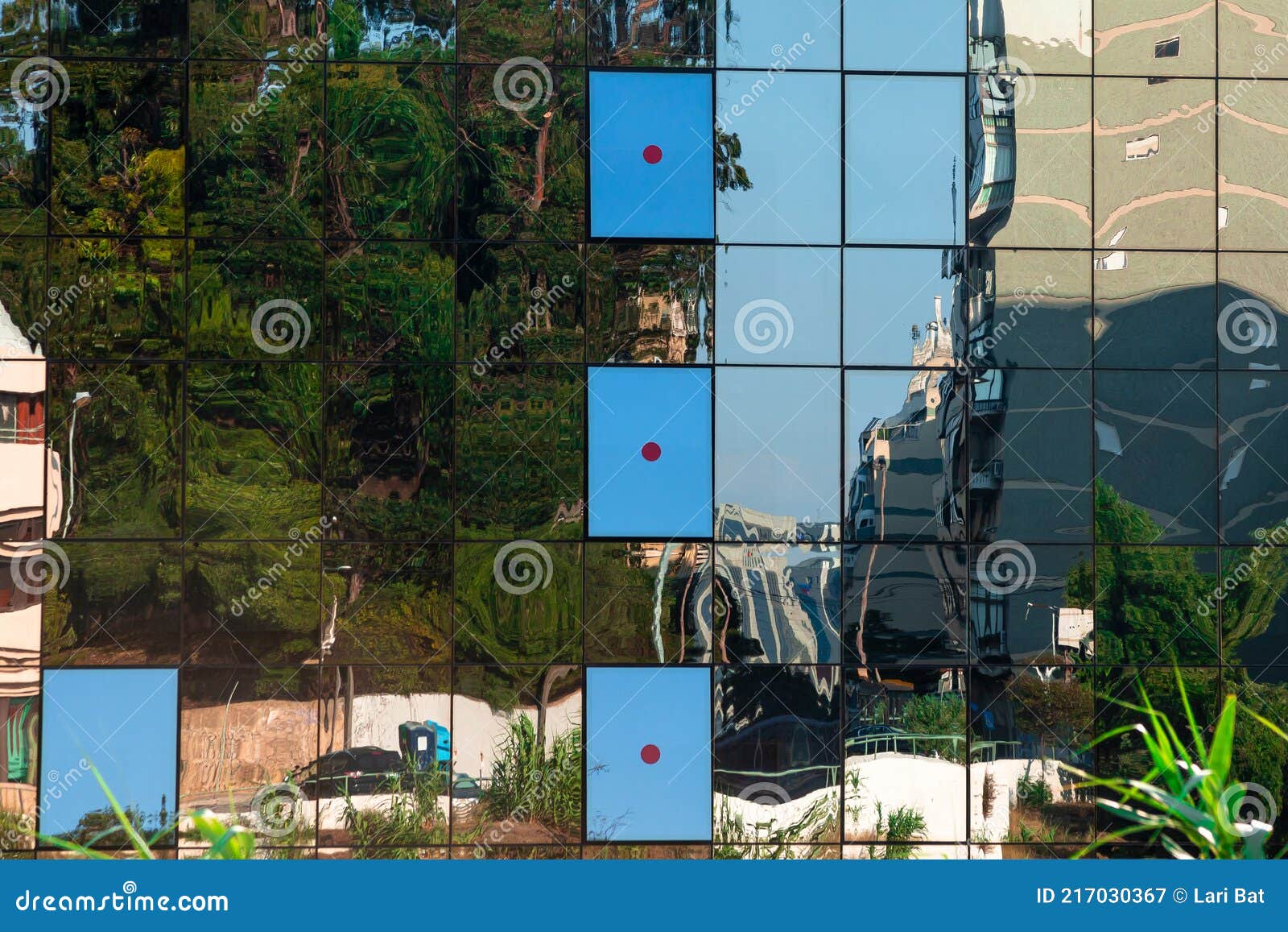 A Bizarre Distorted Reflection of a Residential Building and Trees in ...