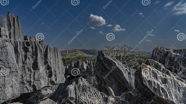 Bizarre Karst Limestone Cliffs Against a Blue Sky and Clouds. Stock ...