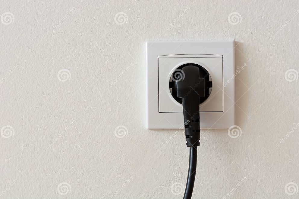 Black 220 Volt Power Plug Plugged in a Socket Stock Image - Image of ...