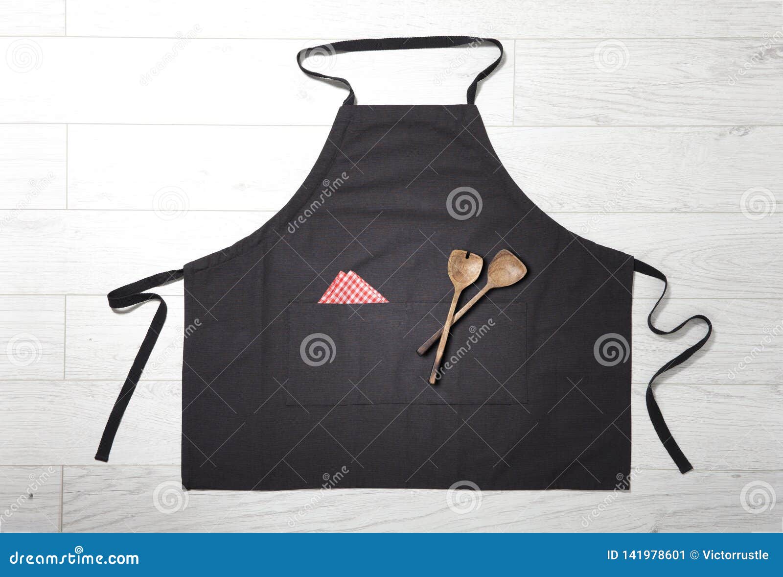 Black Apron for Kitchen Top View on White Wooden Background. Stock ...