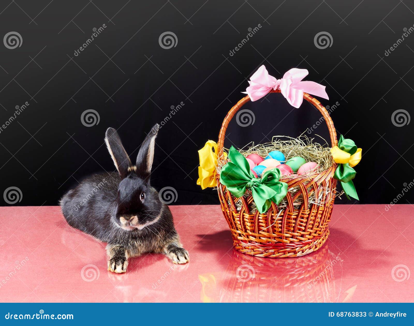 On a Black Background Bunny and Easter Basket with Reflection on Glass ...