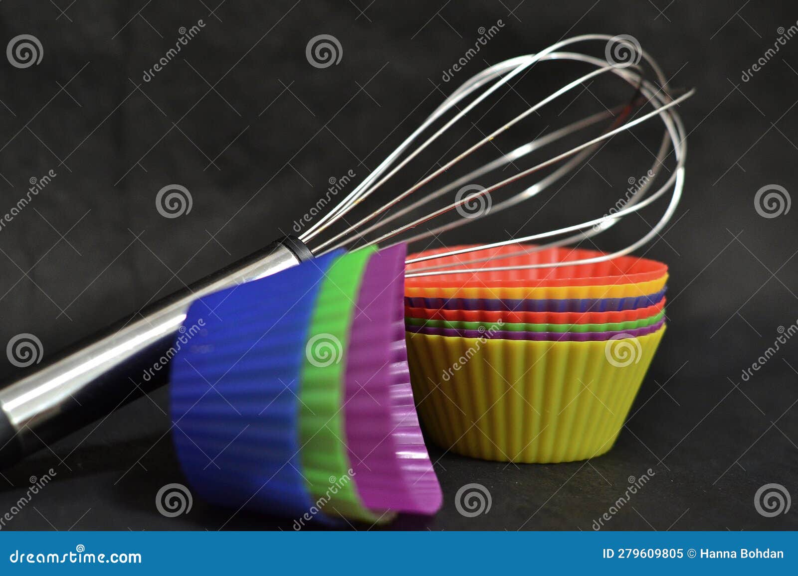 On a Black Background are Confectionery Multi-colored Forms and a Whisk ...