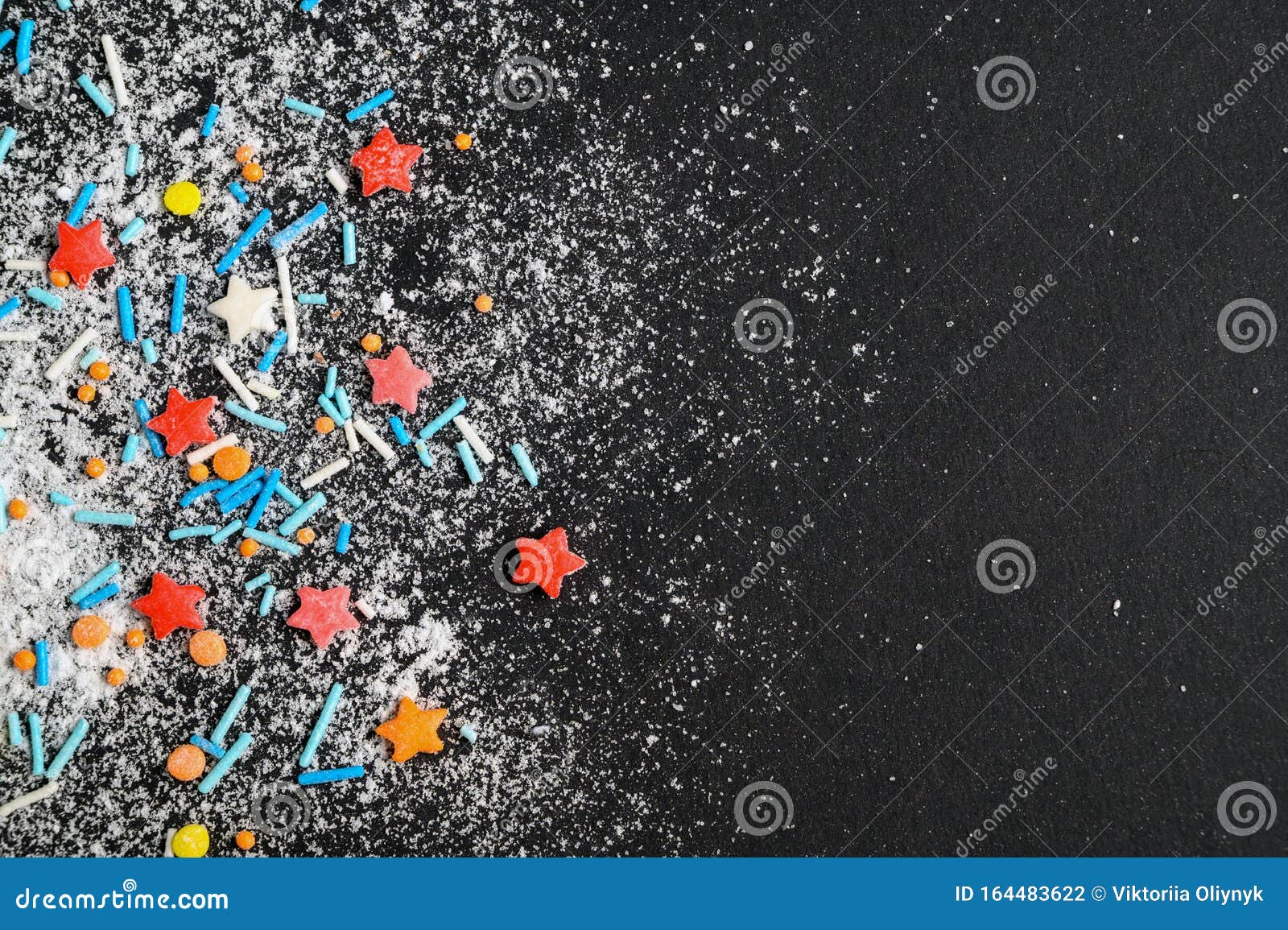 Black Background Dusted with Sugar Powder and Sprinkling Stock Photo ...