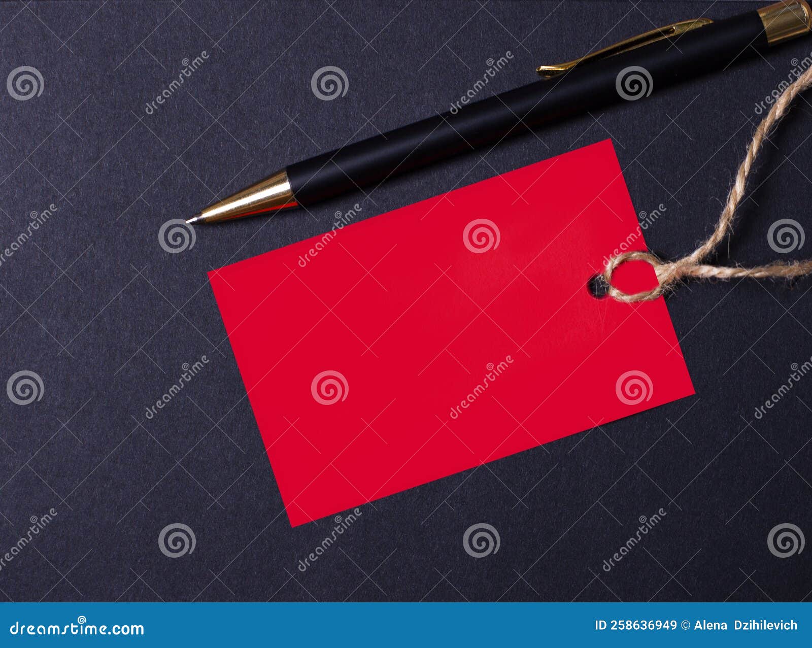 On a Black Background, a Black Pen and an Empty Red Business Card with ... On a Black Background, a Black Pen and an Empty Red Business Card with ...