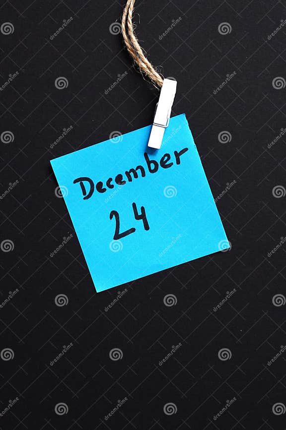 Blue Paper with December 24 Write Stock Photo - Image of font, label ...