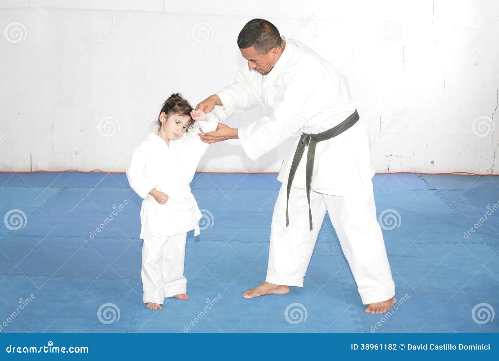 Black Belt Karate Teaching a Little Girl Stock Photo - Image of karate ...