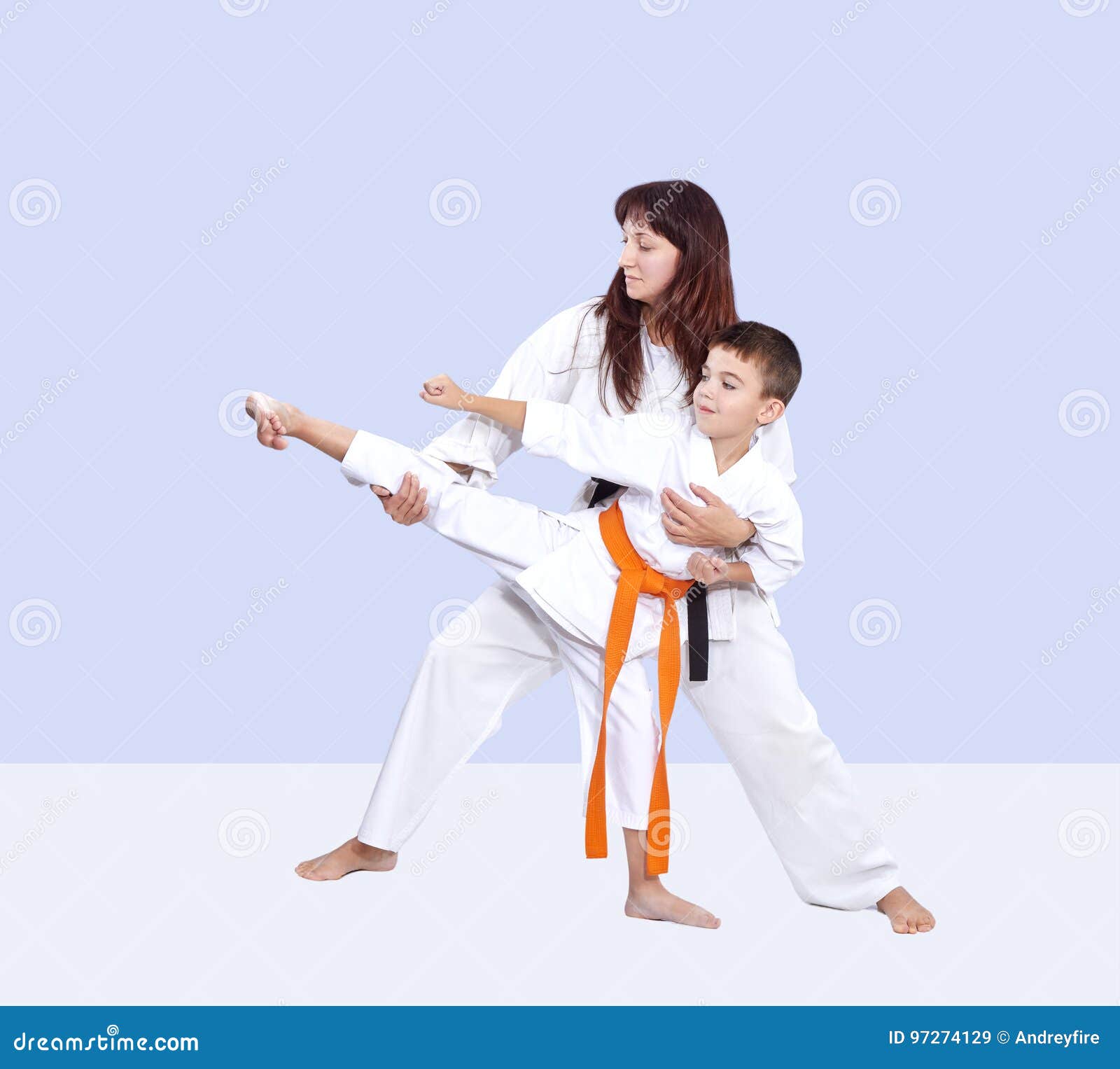 With Black Belt Trainer Teaches the Athlete To Hit a Kick Stock Image ...